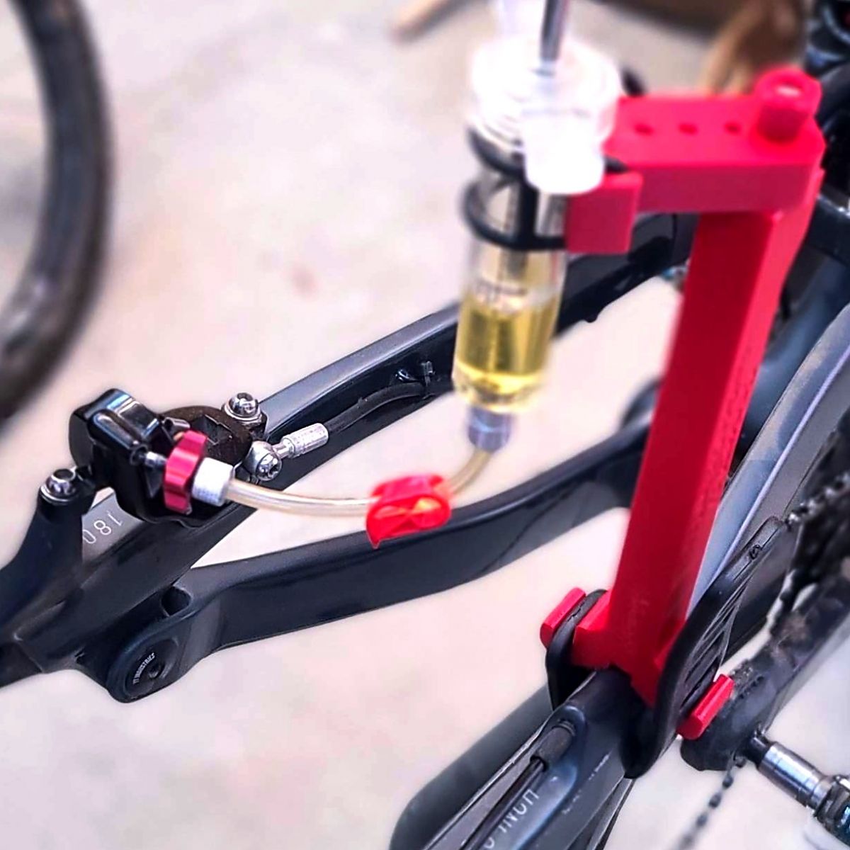 RedSide offers new brake bleed syringe holder | Bicycle Retailer and ...